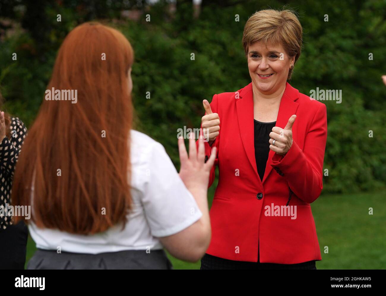 First Minister of Scotland Nicola Sturgeon is shown sign language ...