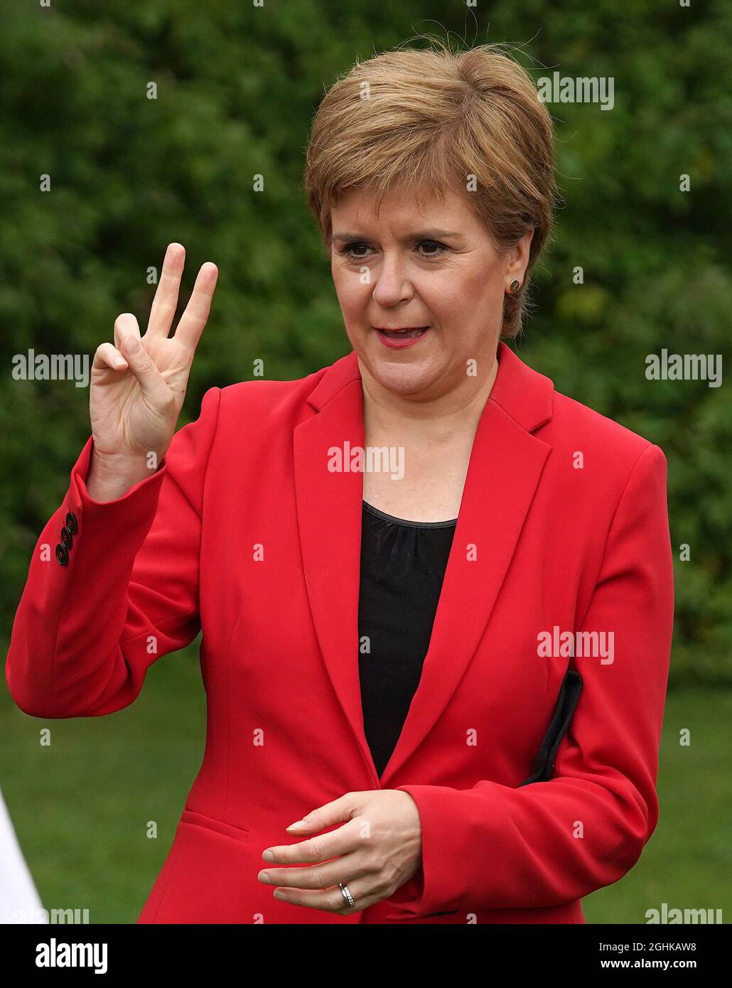First Minister of Scotland Nicola Sturgeon is shown sign language ...