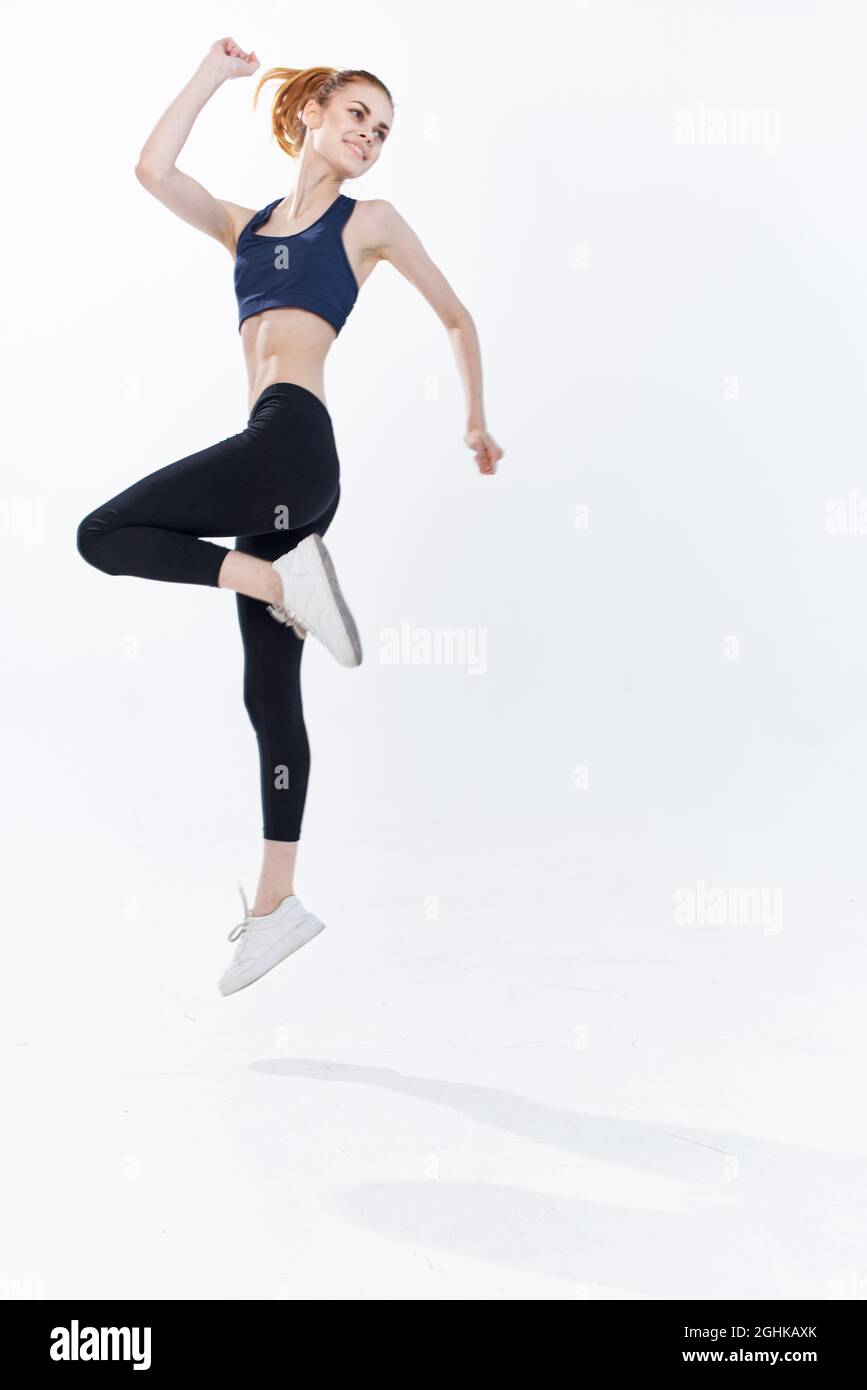 active sports woman jumping workout fitness exercise Stock Photo - Alamy