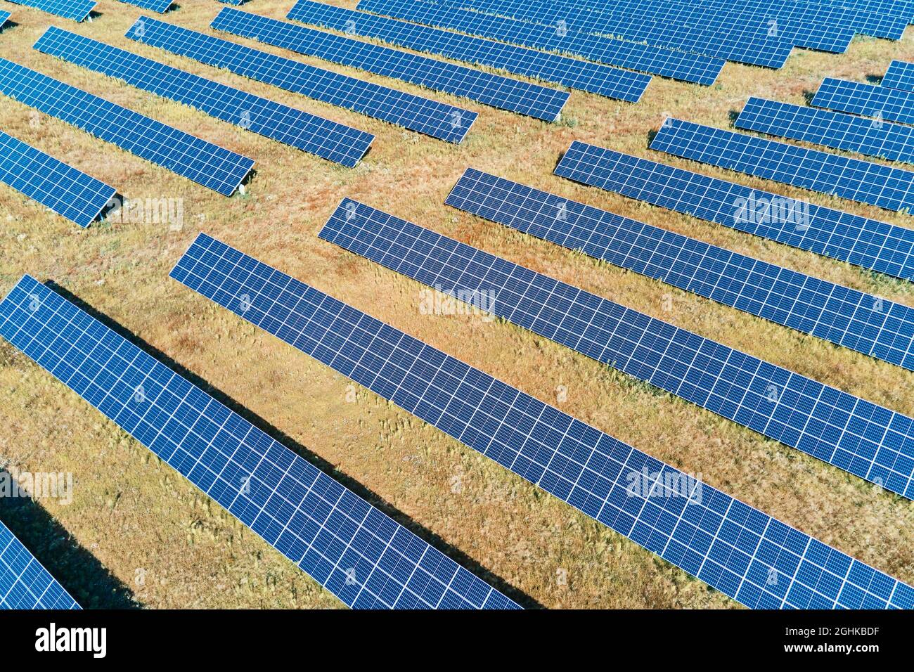Row of solar panels in the field. Solar battery farm, aerial view ...