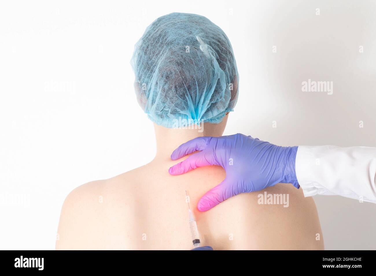 The doctor makes an anesthetic procedure for a girl a subcutaneous ...