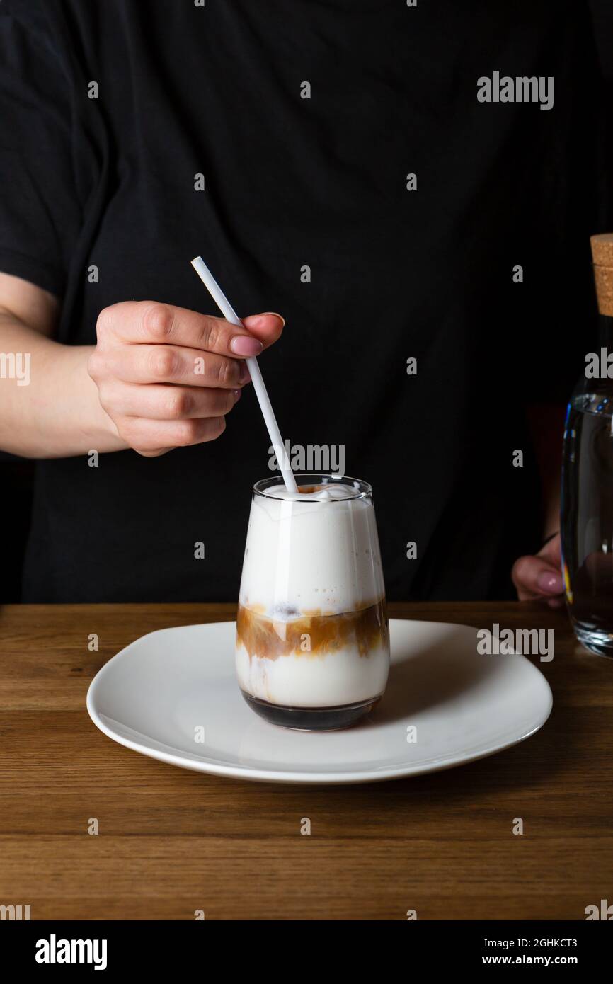 Iced coffee with straw indoor beverages food Stock Photo - Alamy