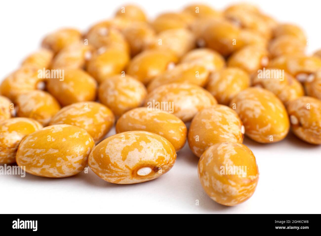 Orange beans on a white background, isolate, close-up, many grains ...