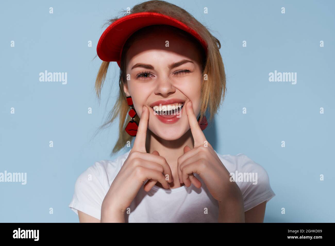 cheerful woman in red cap fun summer studio Stock Photo - Alamy