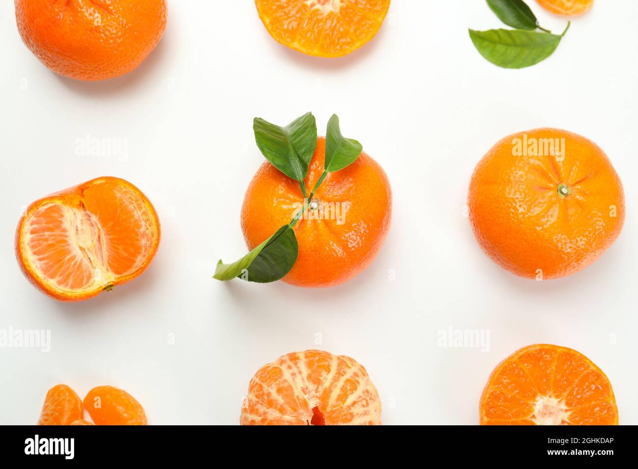 Flat lay with mandarins on white background Stock Photo - Alamy