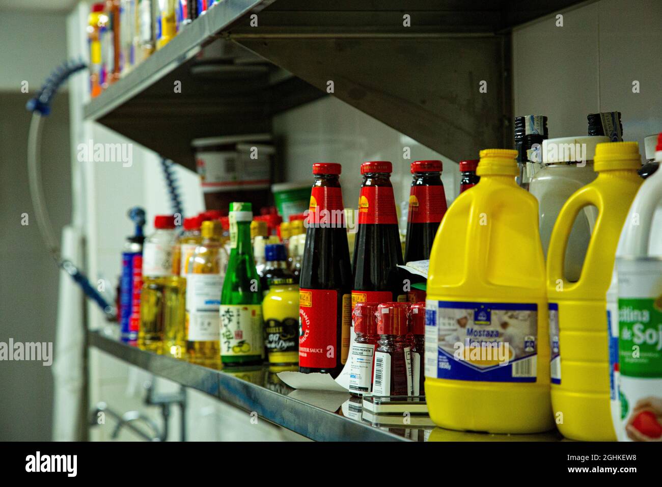 Kitchen shelf with various sauces Stock Photo - Alamy