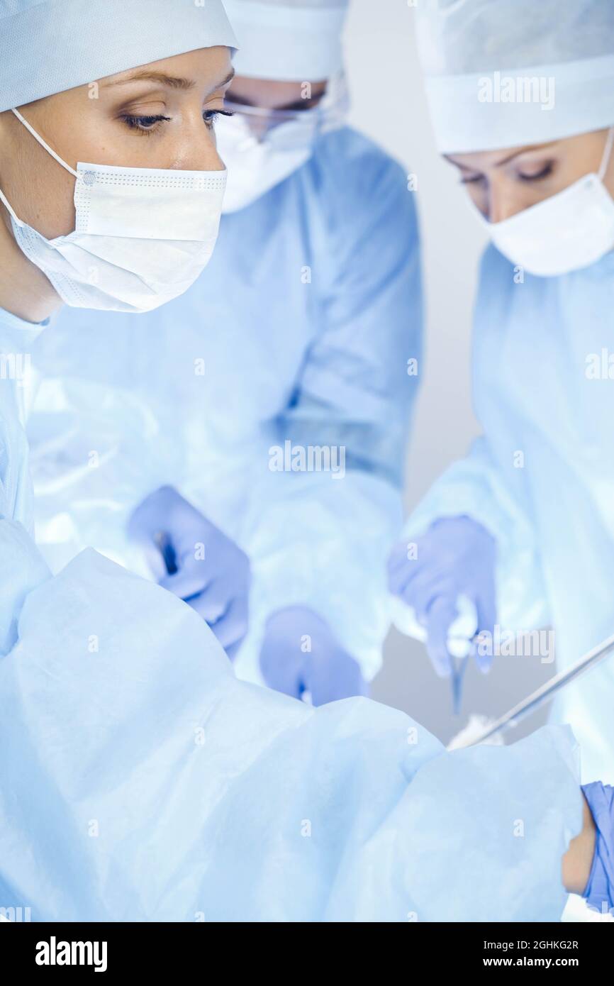 A group of surgeons is operating at the hospital. Health care concept ...