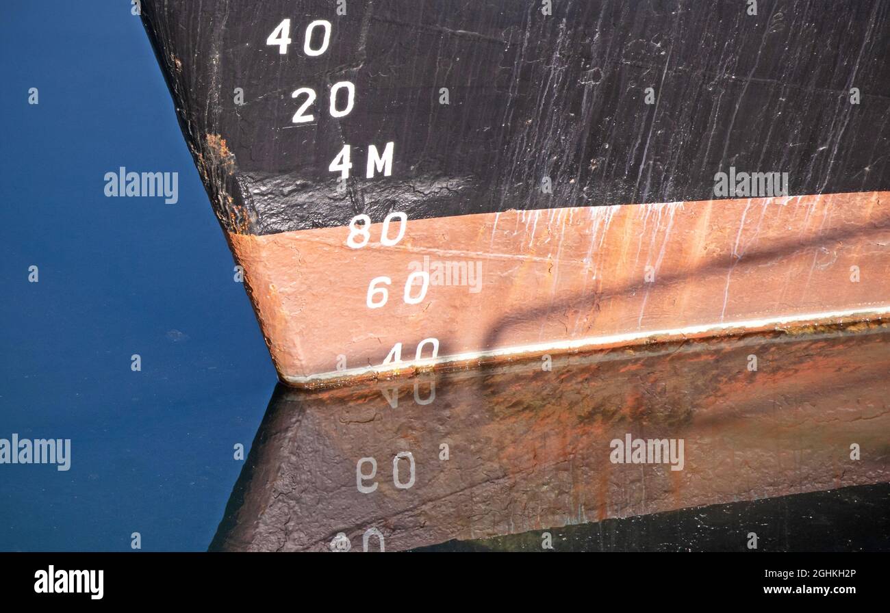 Draft measurement scale or depth gauge on the hull of a large ship ...
