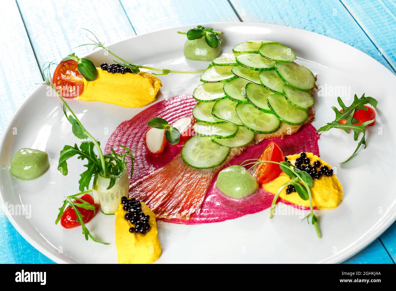 Fish dish - fried fish fillet and vegetables Stock Photo - Alamy