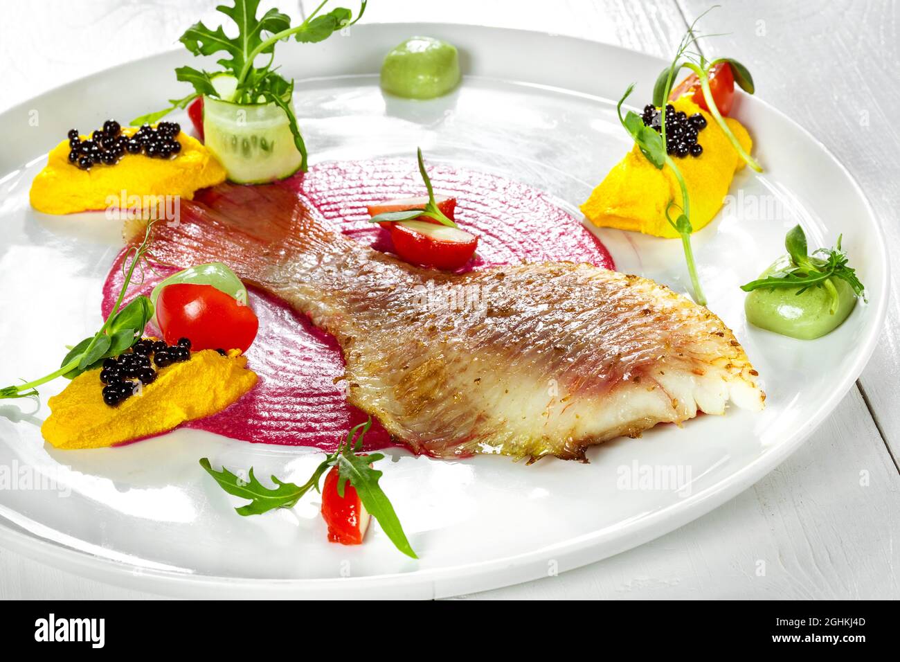 Fish dish - fried fish fillet and vegetables Stock Photo - Alamy
