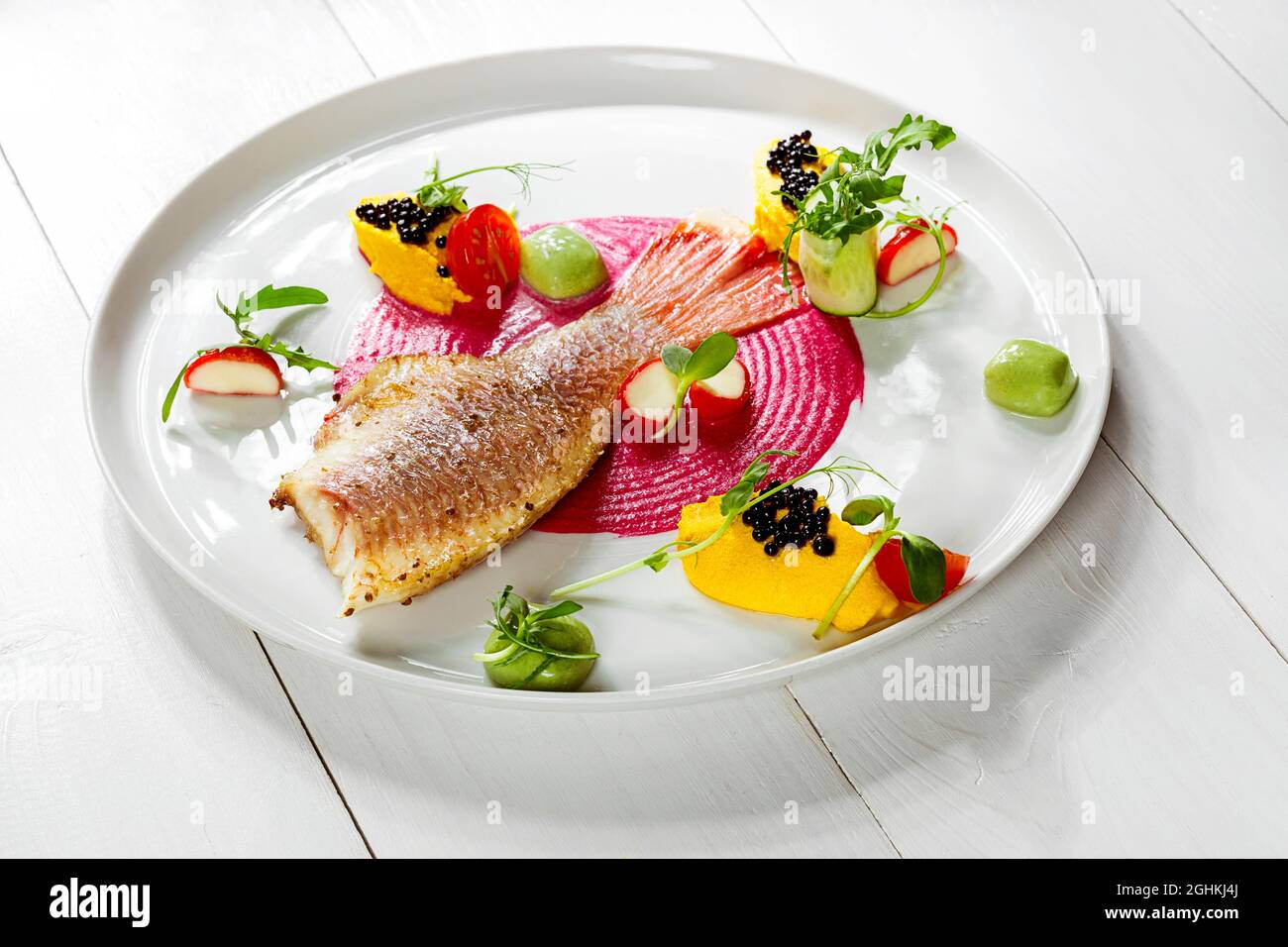 Fish dish - fried fish fillet and vegetables Stock Photo - Alamy