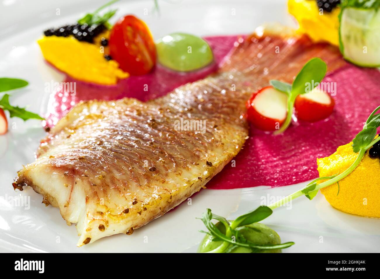 Fish dish - fried fish fillet and vegetables Stock Photo - Alamy