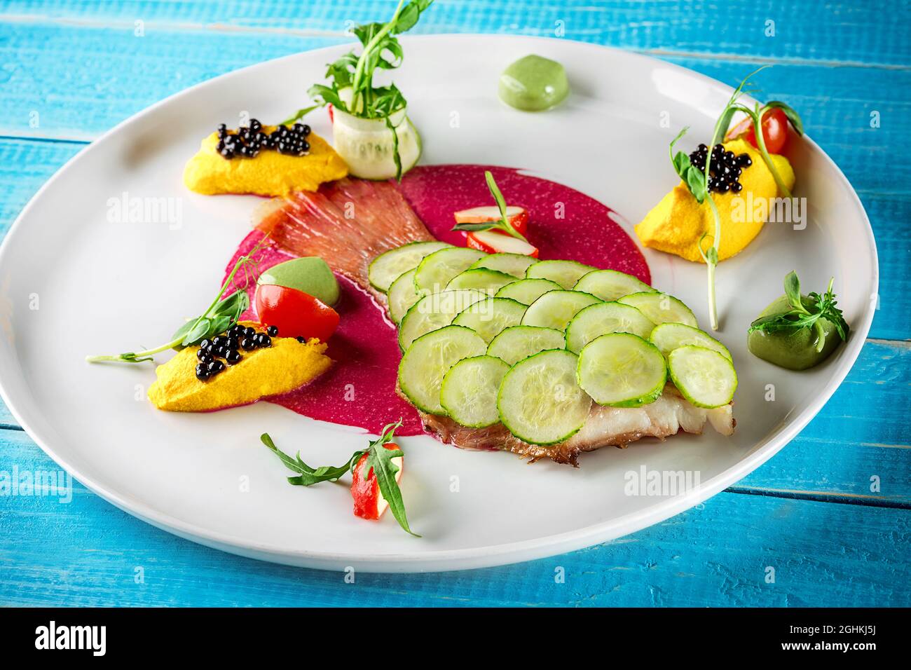 Fish dish - fried fish fillet and vegetables Stock Photo - Alamy