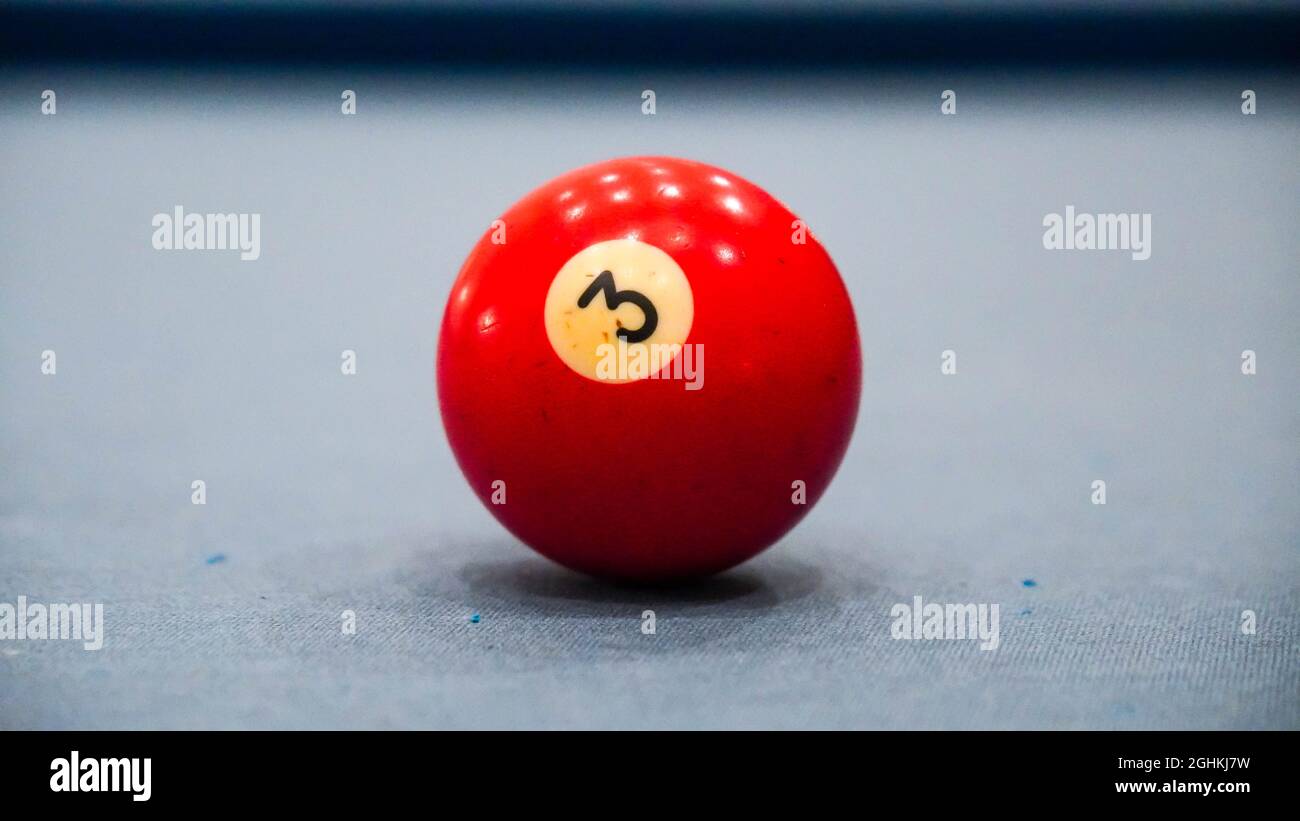 Selective focus on the red snooker ball or pool on the snooker table ...