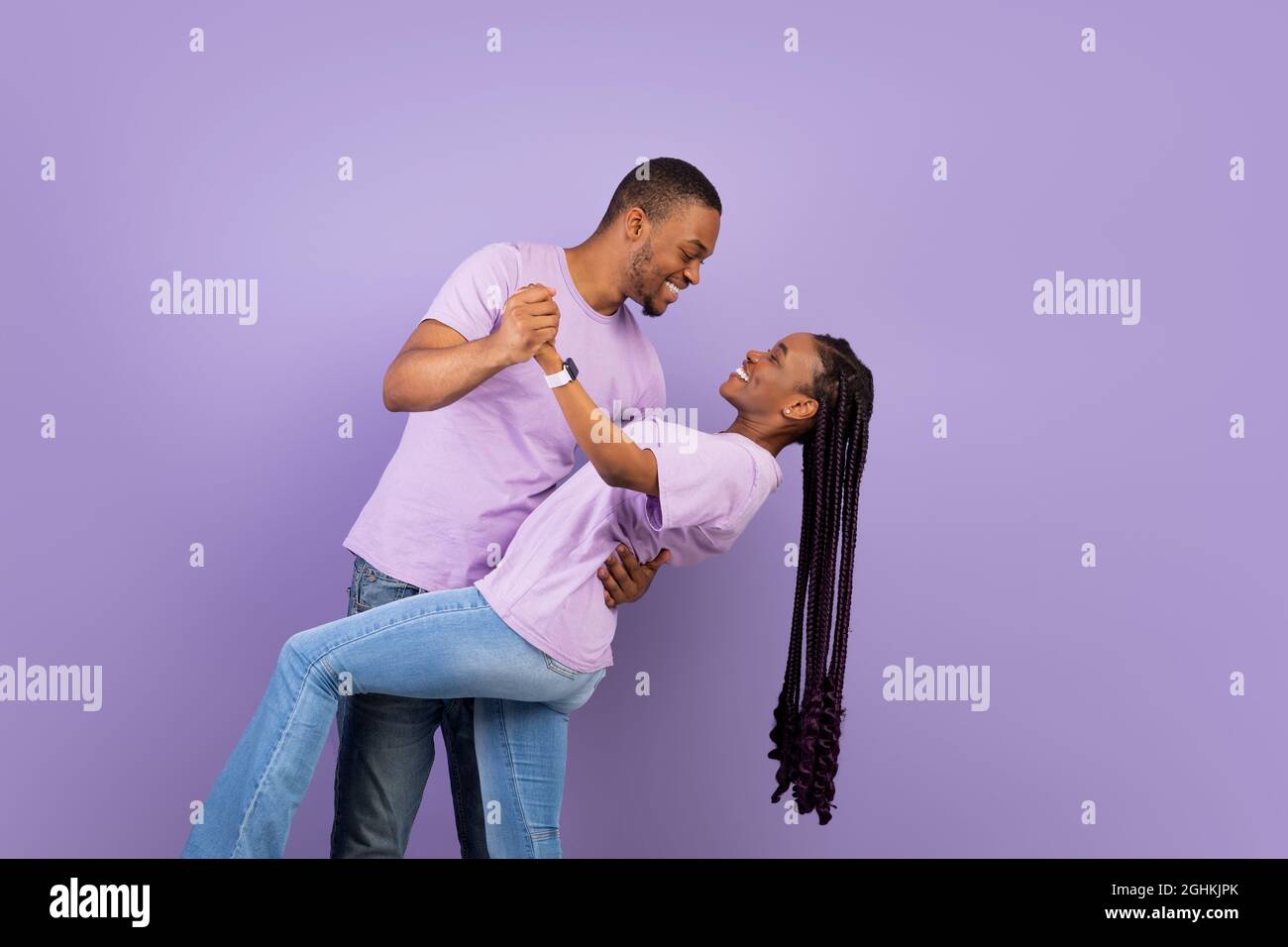 Portrait of romantic black couple dancing at studio Stock Photo - Alamy