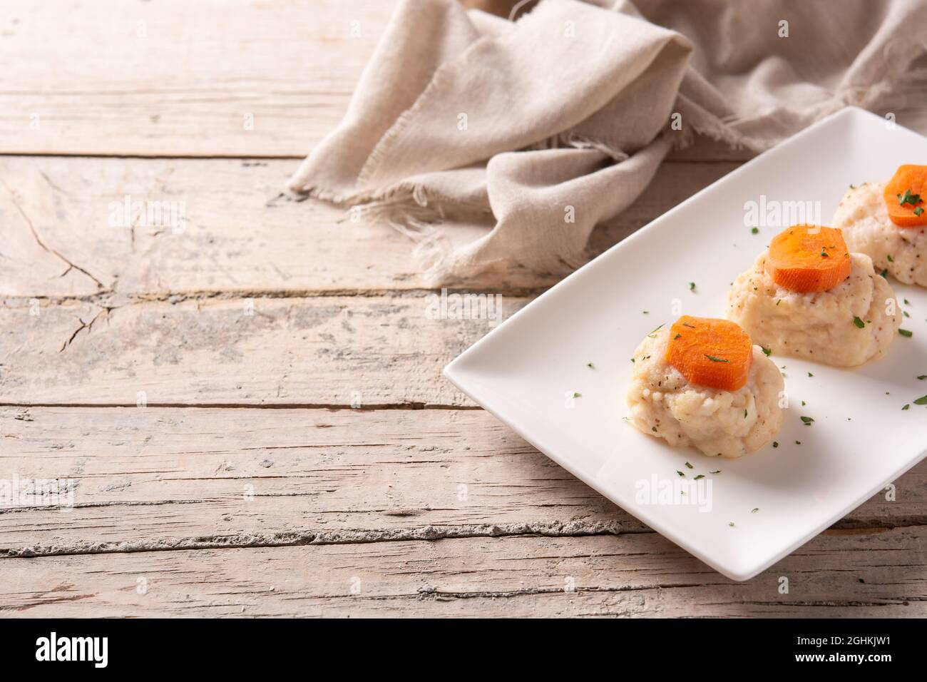 Traditional Jewish gefilte fish on wooden table Stock Photo - Alamy