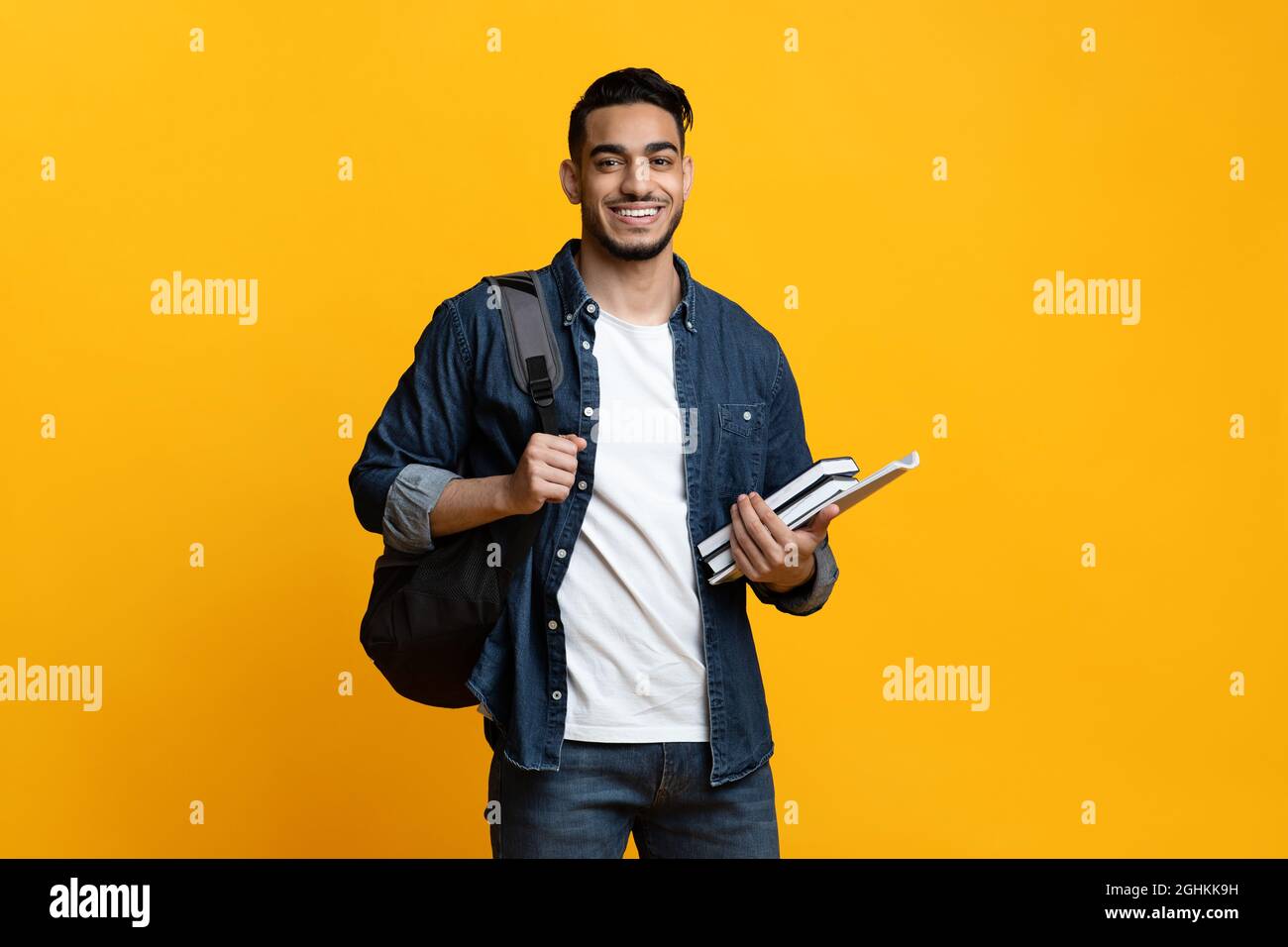 Smart arab guy student with backpack and books Stock Photo - Alamy