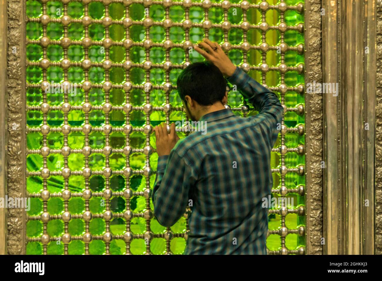 A man next to a holy place to answer a prayer Stock Photo - Alamy