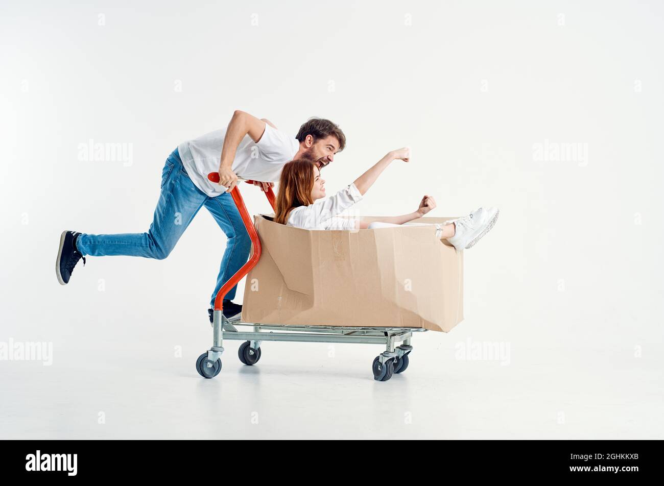 Man and woman shipping transport in a box isolated background Stock ...