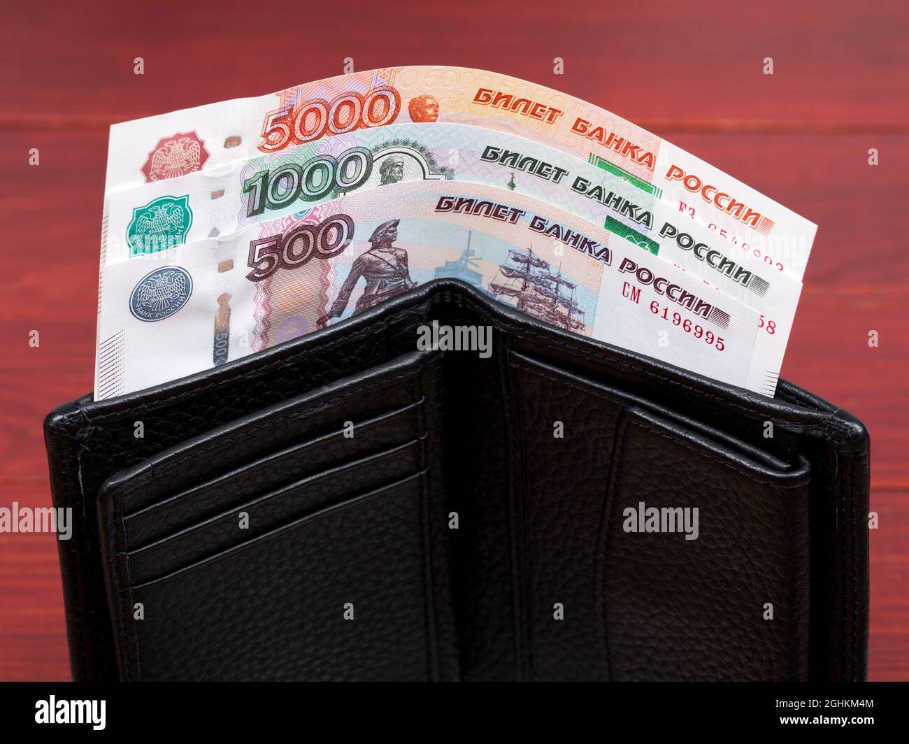 Russian ruble in the black wallet Stock Photo - Alamy