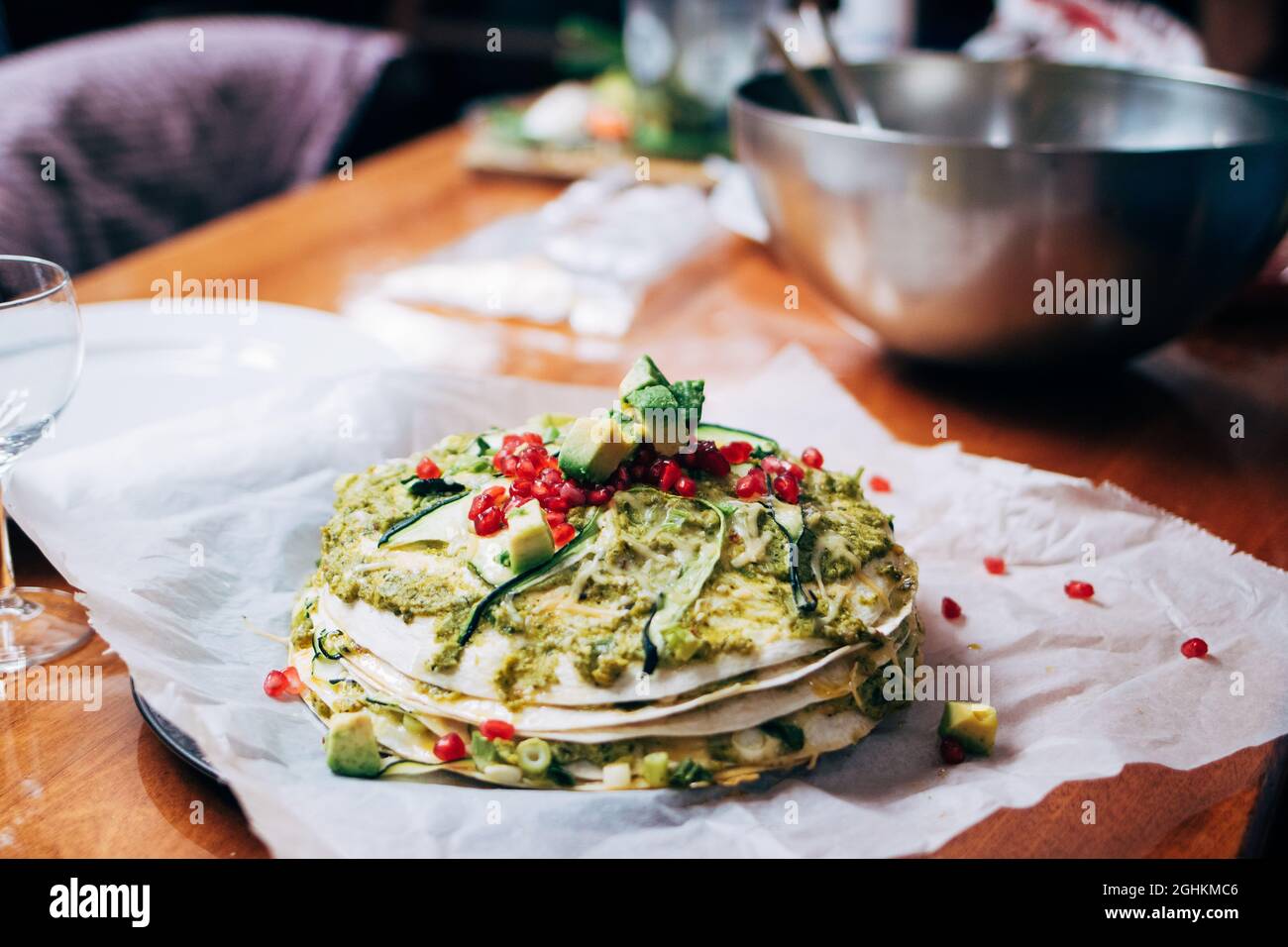 Messy food table with colorful vegetarian healthy dish - tortilla pie ...