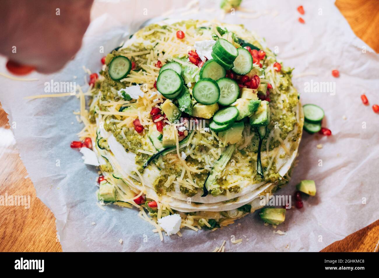 Messy food table with colorful vegetarian healthy dish - tortilla pie ...