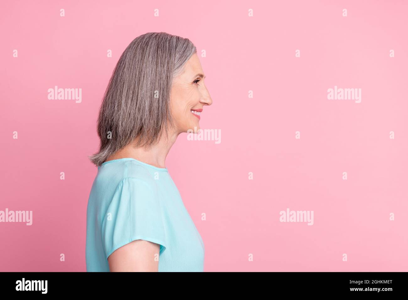 Profile photo of cute elder grey hairdo lady look empty space wear blue ...