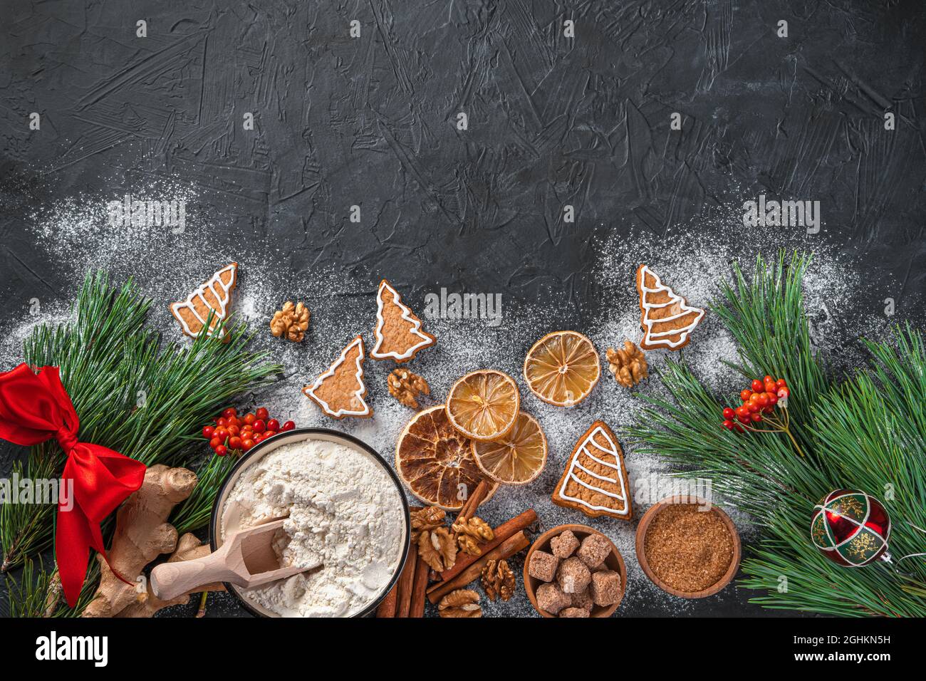 Christmas cooking background with ginger cookies and ingredients on a ...