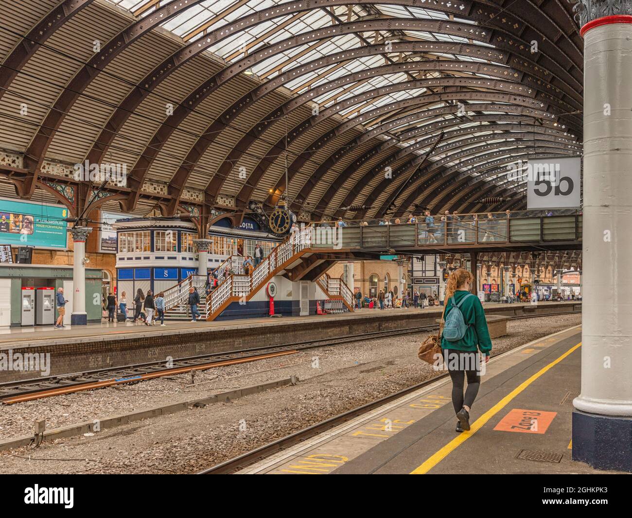 A view of a railway station concourse. An 18th century iron canopy with ...