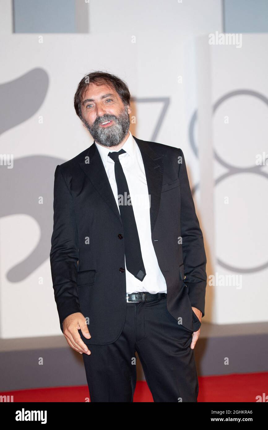 Stefano Mordini walking the red carpet for the premiere of the film La ...