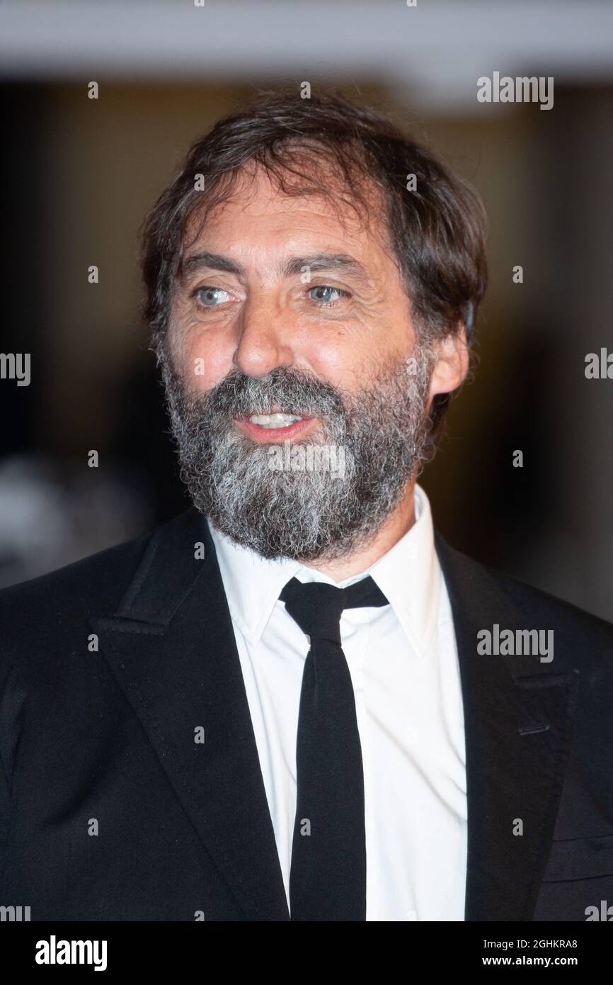 Stefano Mordini walking the red carpet for the premiere of the film La ...