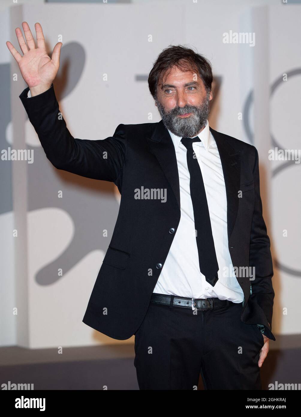 Stefano Mordini walking the red carpet for the premiere of the film La ...