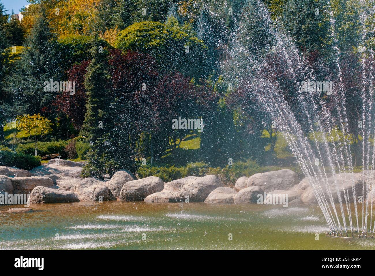 Big water fountain squirting water up in the air in Dikmen Valley Park ...