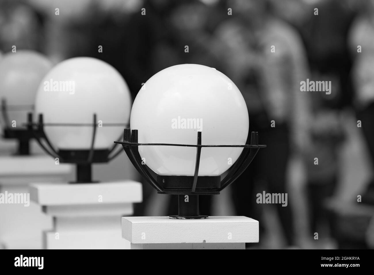 Grayscale shot of sphere-shaped street lamps Stock Photo - Alamy