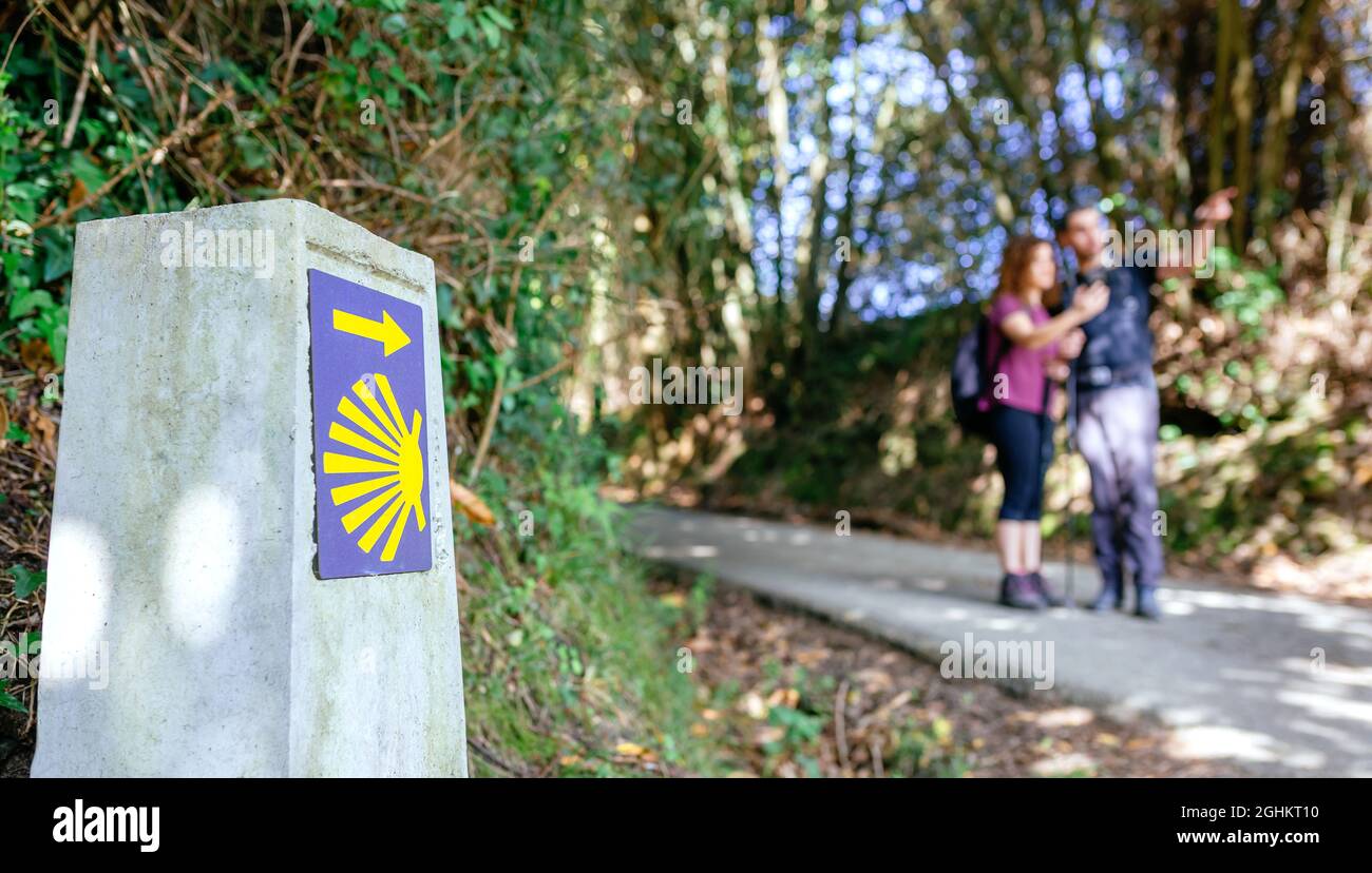 Signpost of Saint James way with pilgrims pointing Stock Photo - Alamy