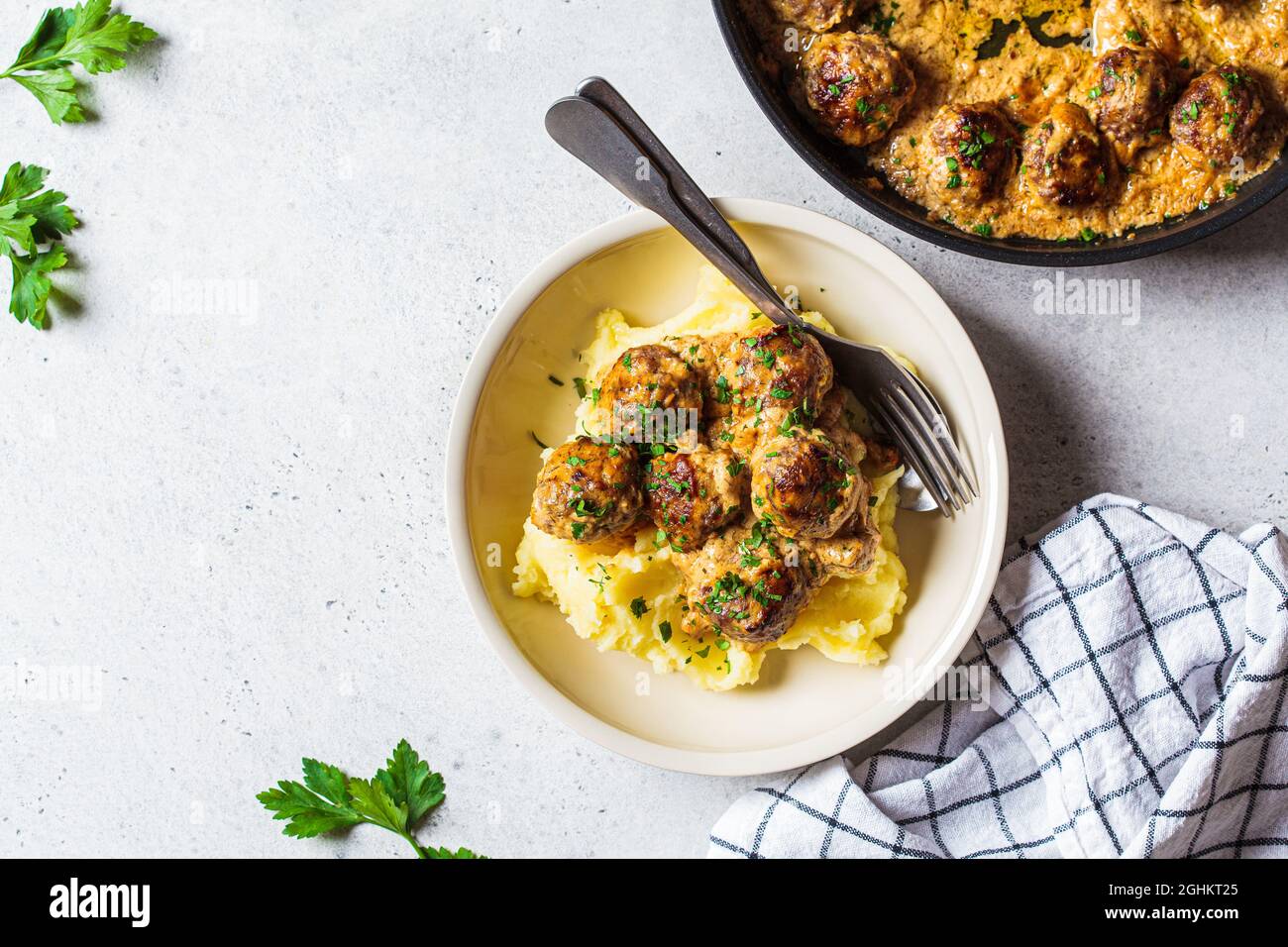 Swedish meatballs in creamy sauce with mashed potatoes in white plate ...