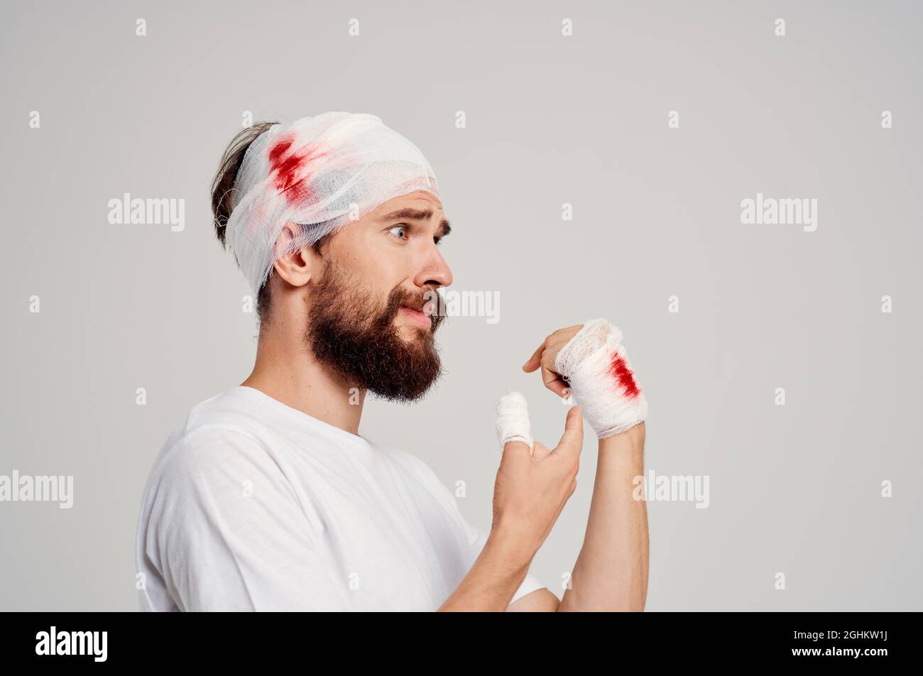 patient bandaged head and hand blood isolated background Stock Photo ...
