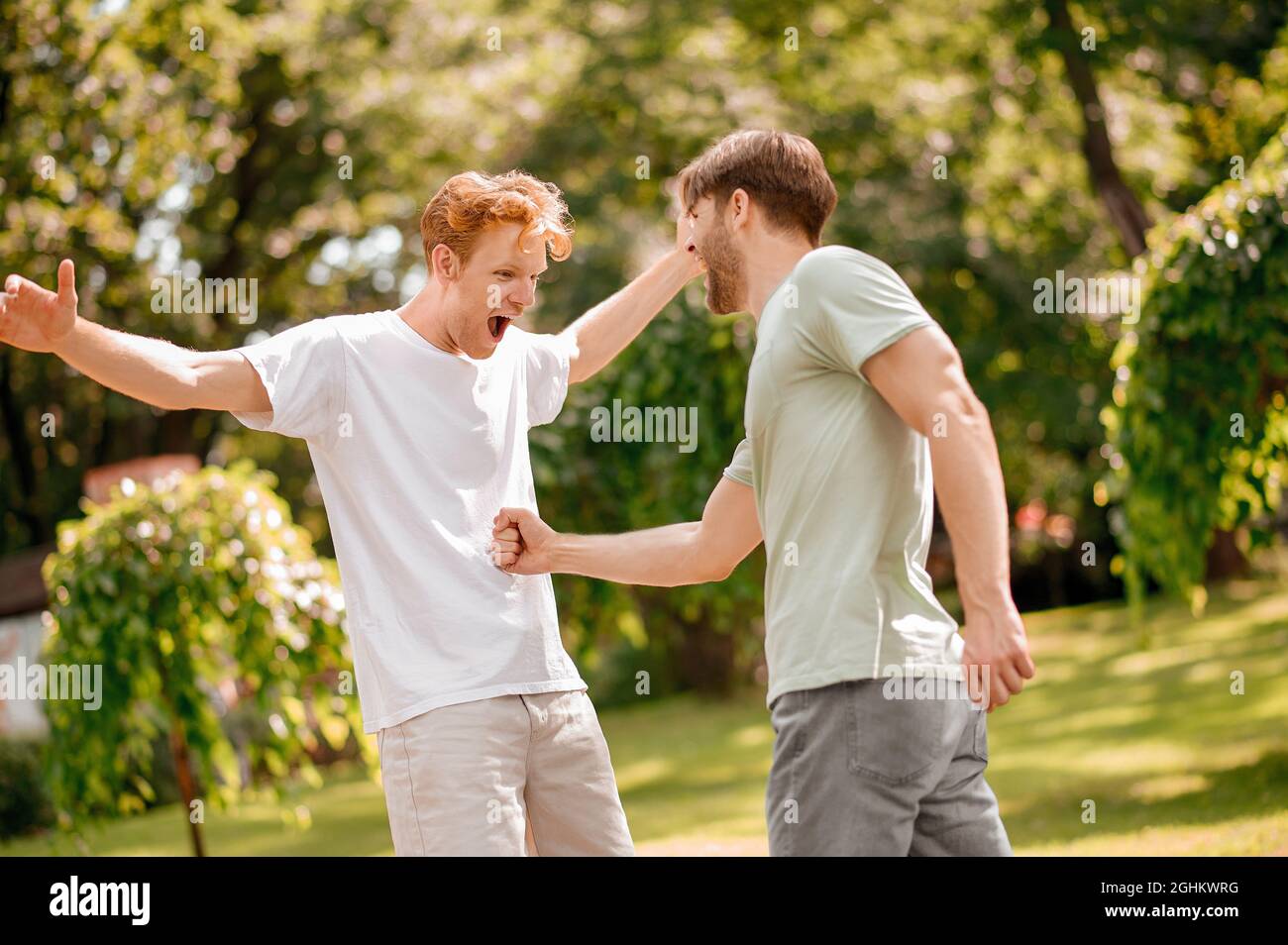 Two friends having fun in nature Stock Photo - Alamy
