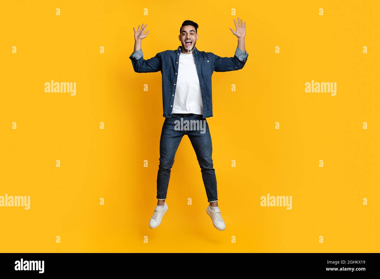 Young man raising finger hi-res stock photography and images - Alamy