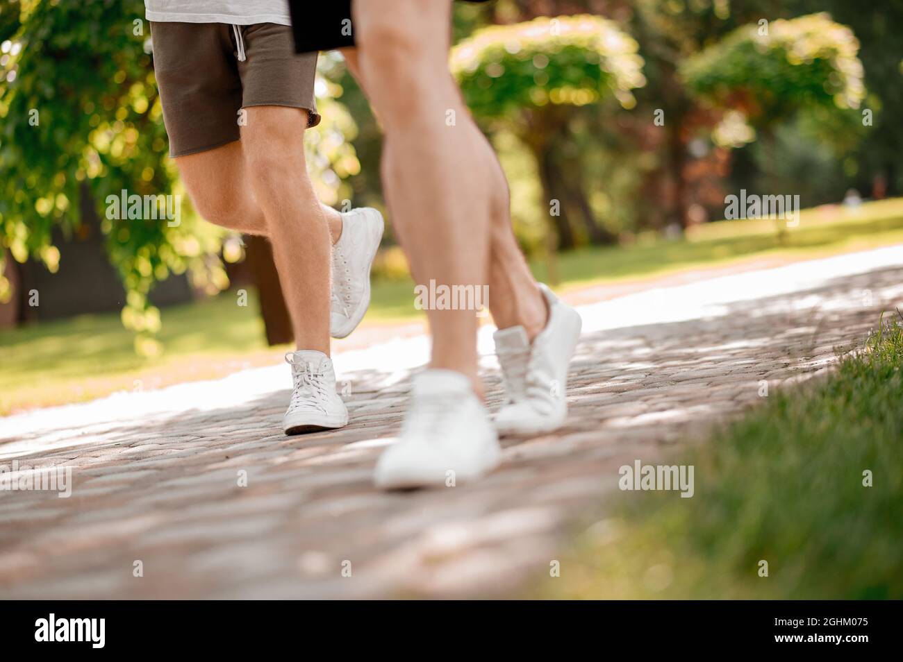 Male legs running along the park path Stock Photo - Alamy