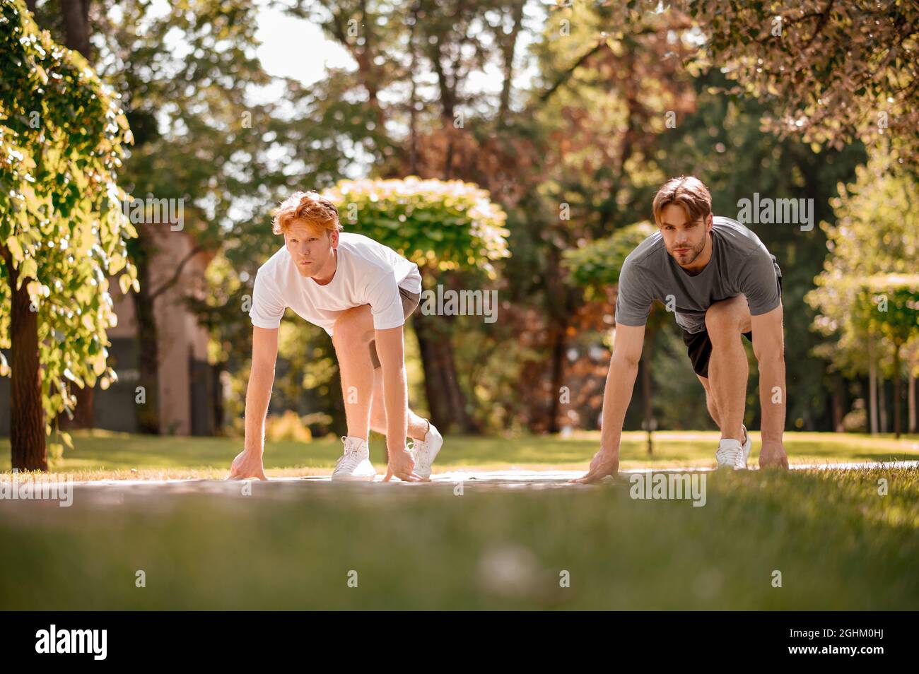 Guys getting ready for running competition Stock Photo - Alamy