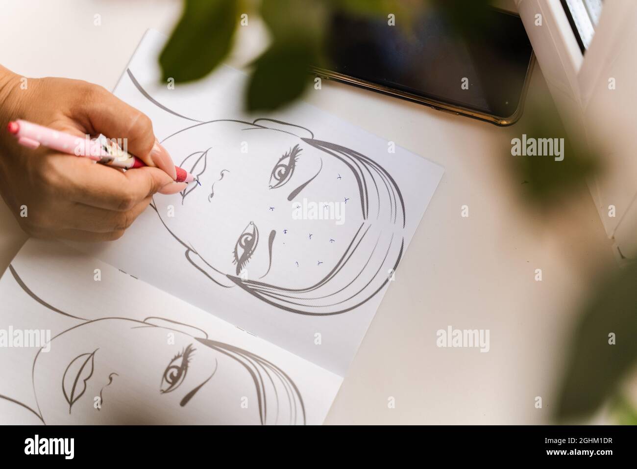 Beautician drawing zone of mimic activity in the patient chart in the ...