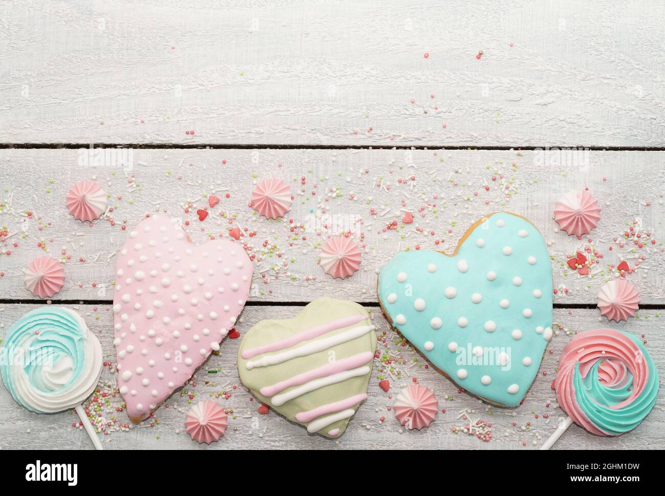 Easter cooking baking background with pastel colored easter cookies and ...