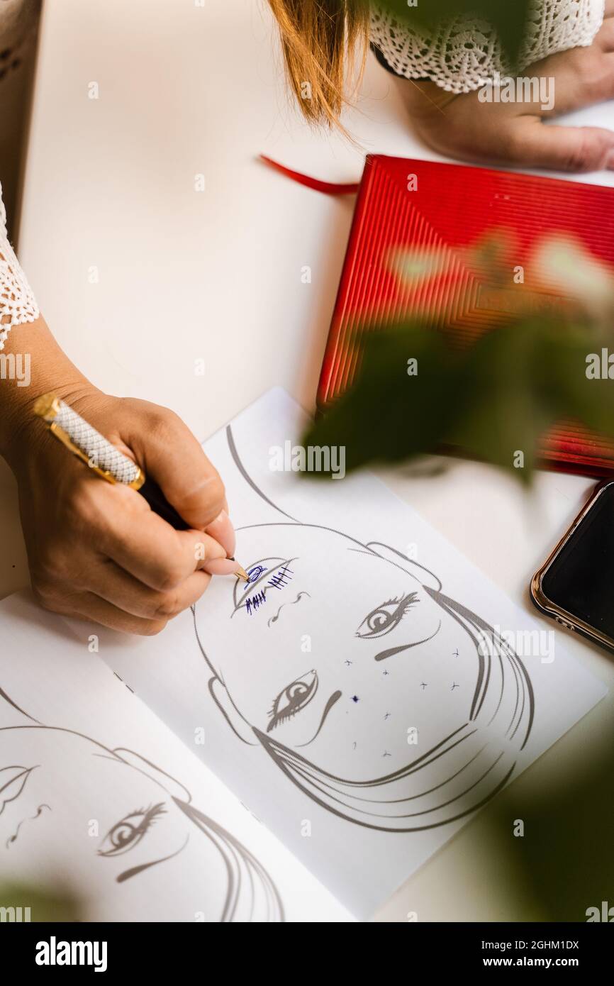 Beautician drawing zone of mimic activity in the patient chart in the ...