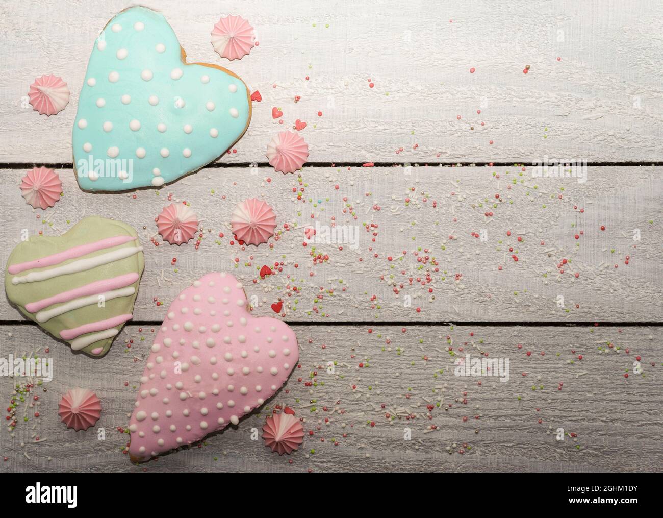 Easter cooking baking background with pastel colored easter cookies and ...