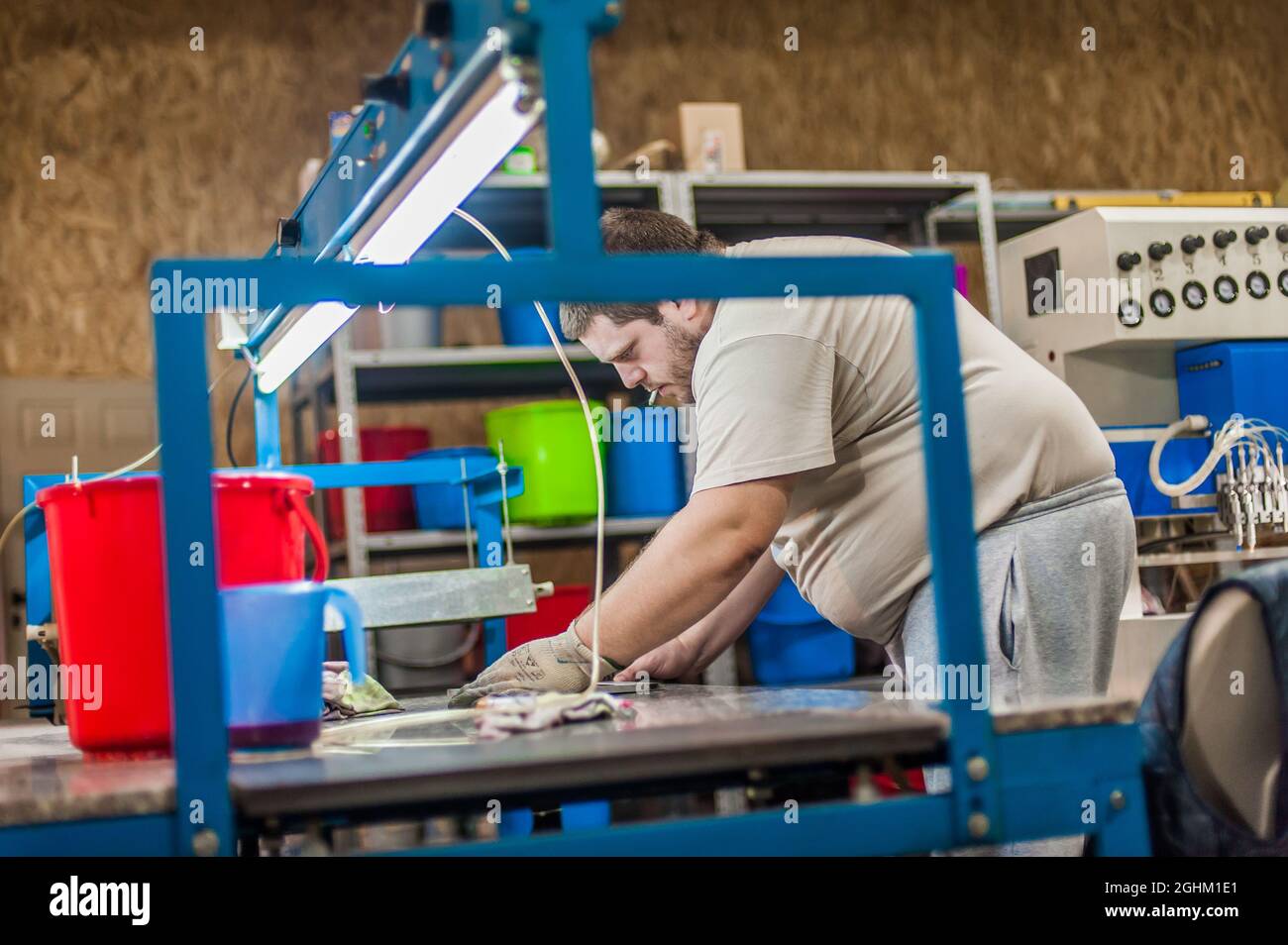 Professional worker technician machinist work in factory production ...