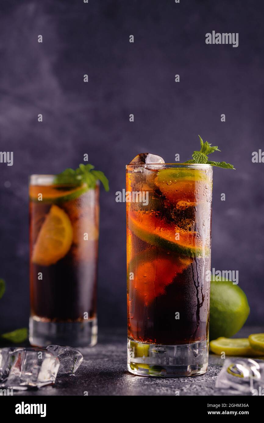 Rum and Cola cocktail Cuba Libre with lime and ice Stock Photo - Alamy