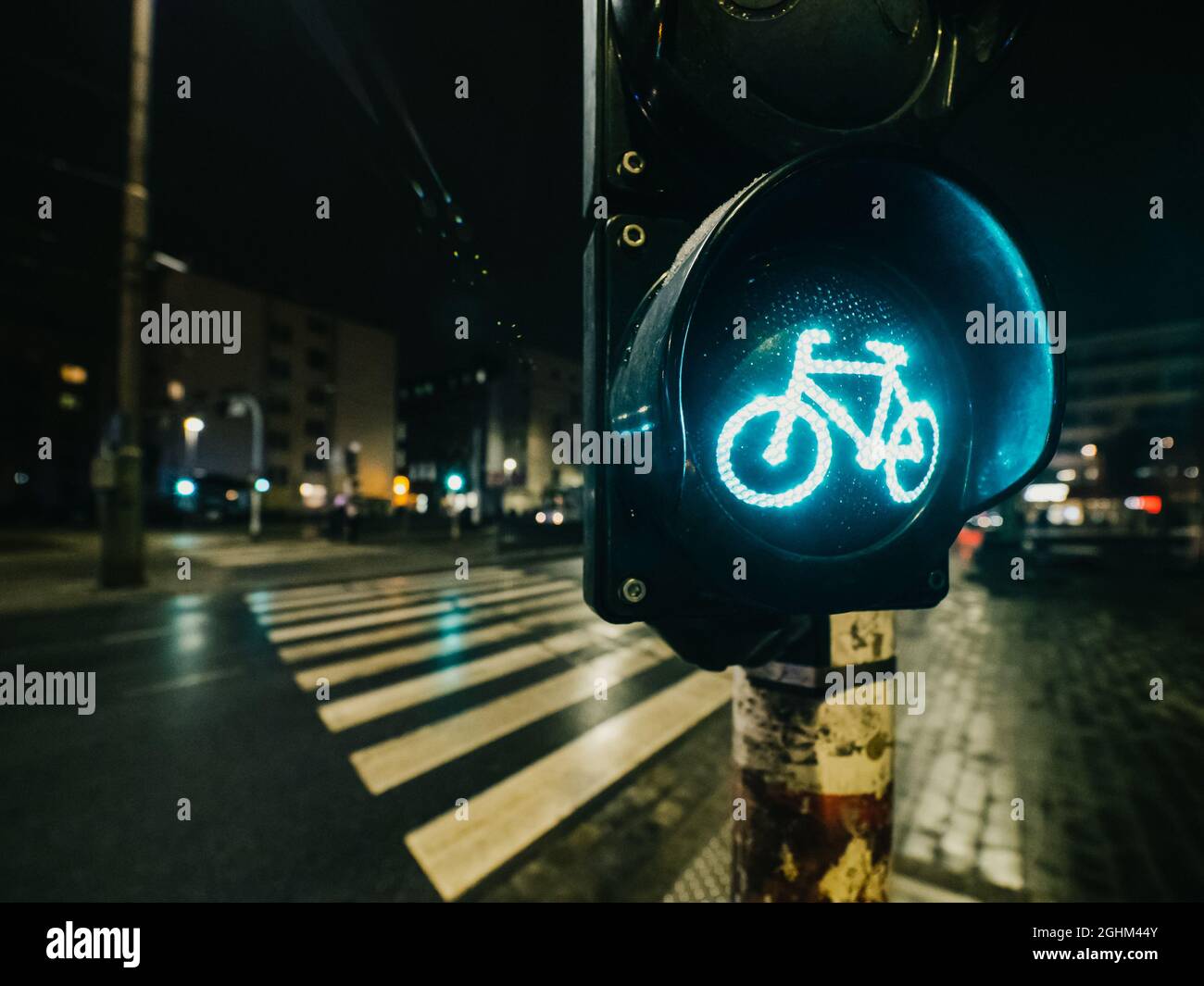 green light of bicycle traffic light on night city crossroad Stock ...