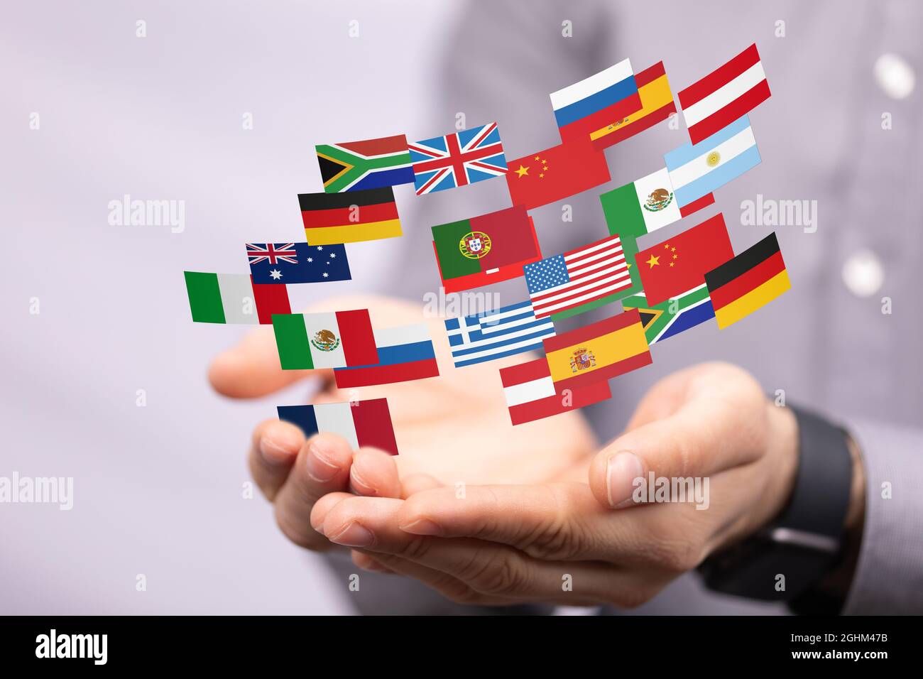 3d rendering of country flags hovering over human palms Stock Photo - Alamy