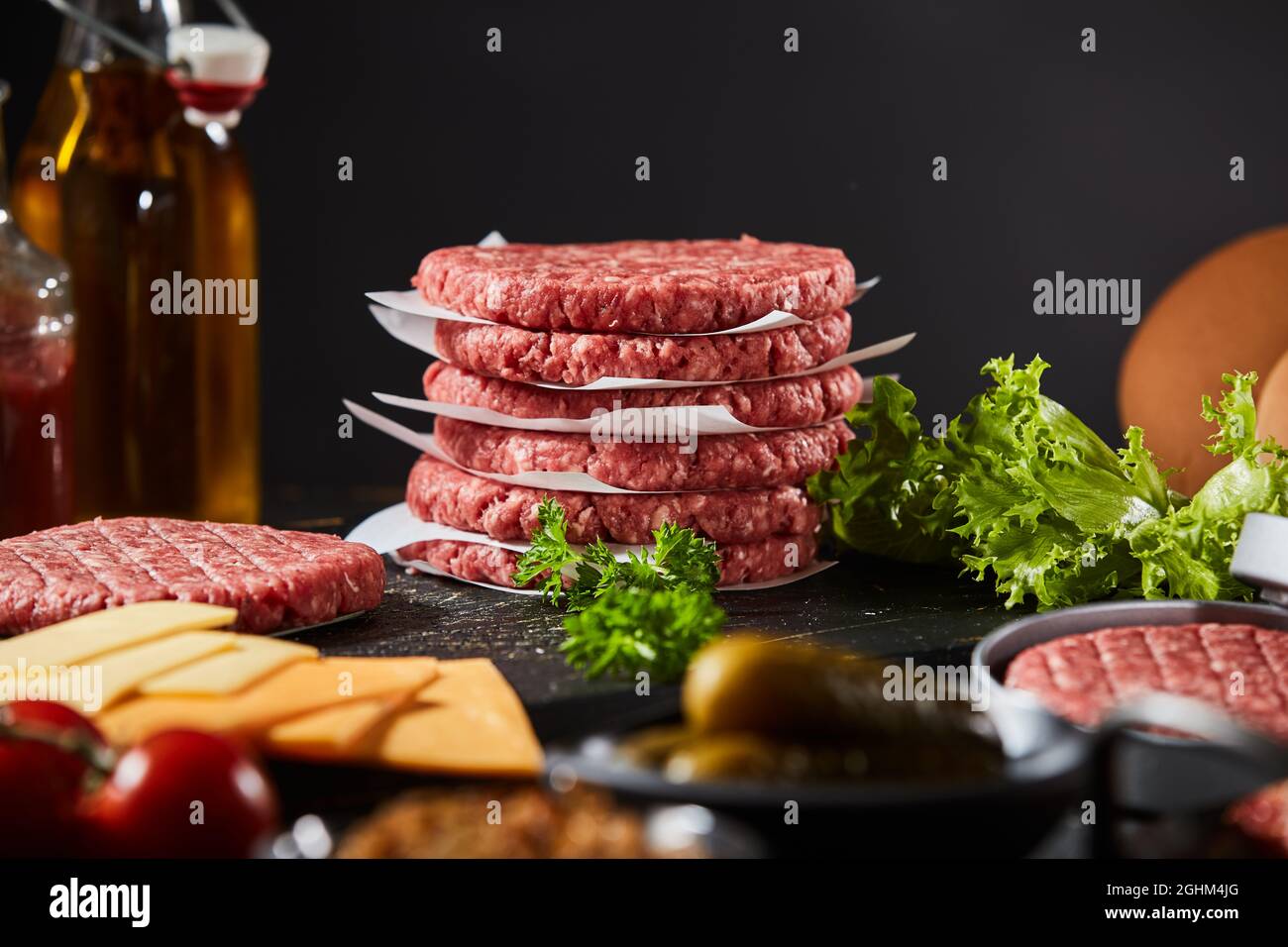 Stack of freshly prepared homemade ground beef patties for traditional ...